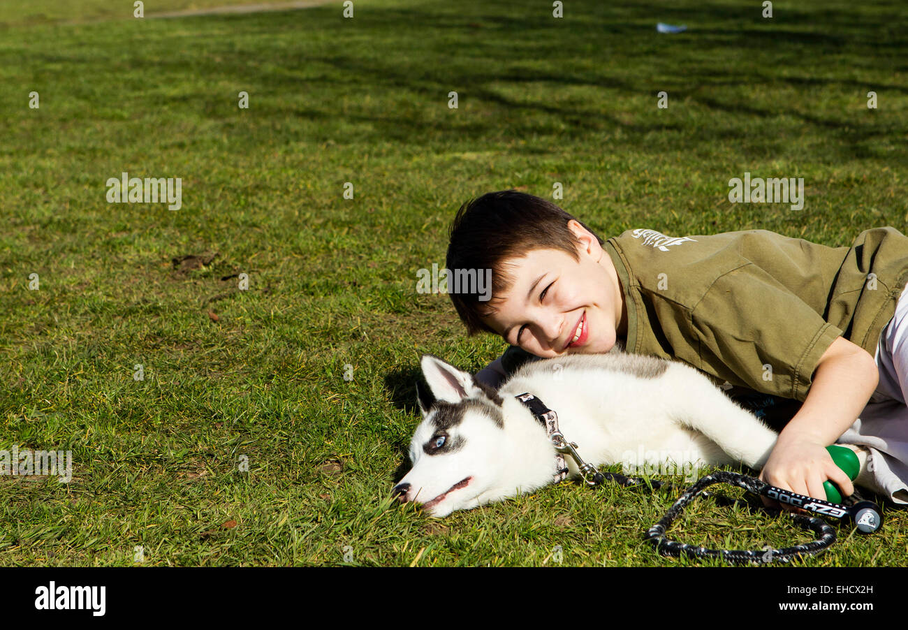 Happy boy with puppy hi-res stock photography and images - Alamy