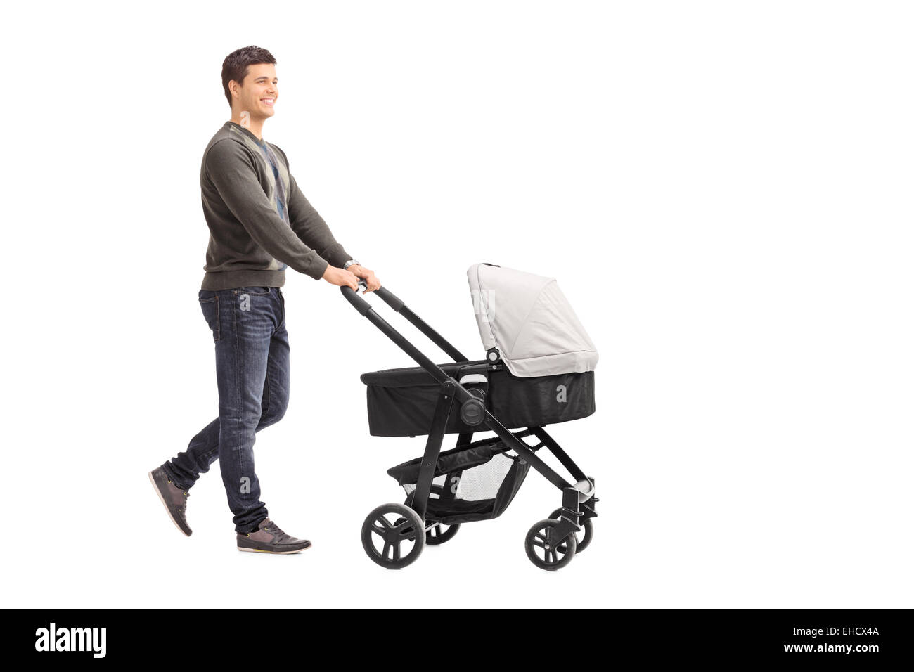 Full length portrait of a young father pushing a baby stroller isolated ...