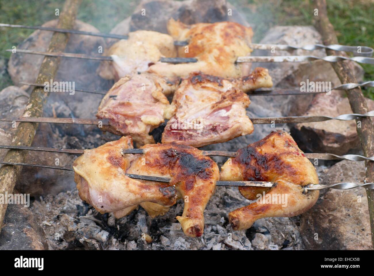 Appetizing grilled chiken kebab on metal skewers Stock Photo - Alamy