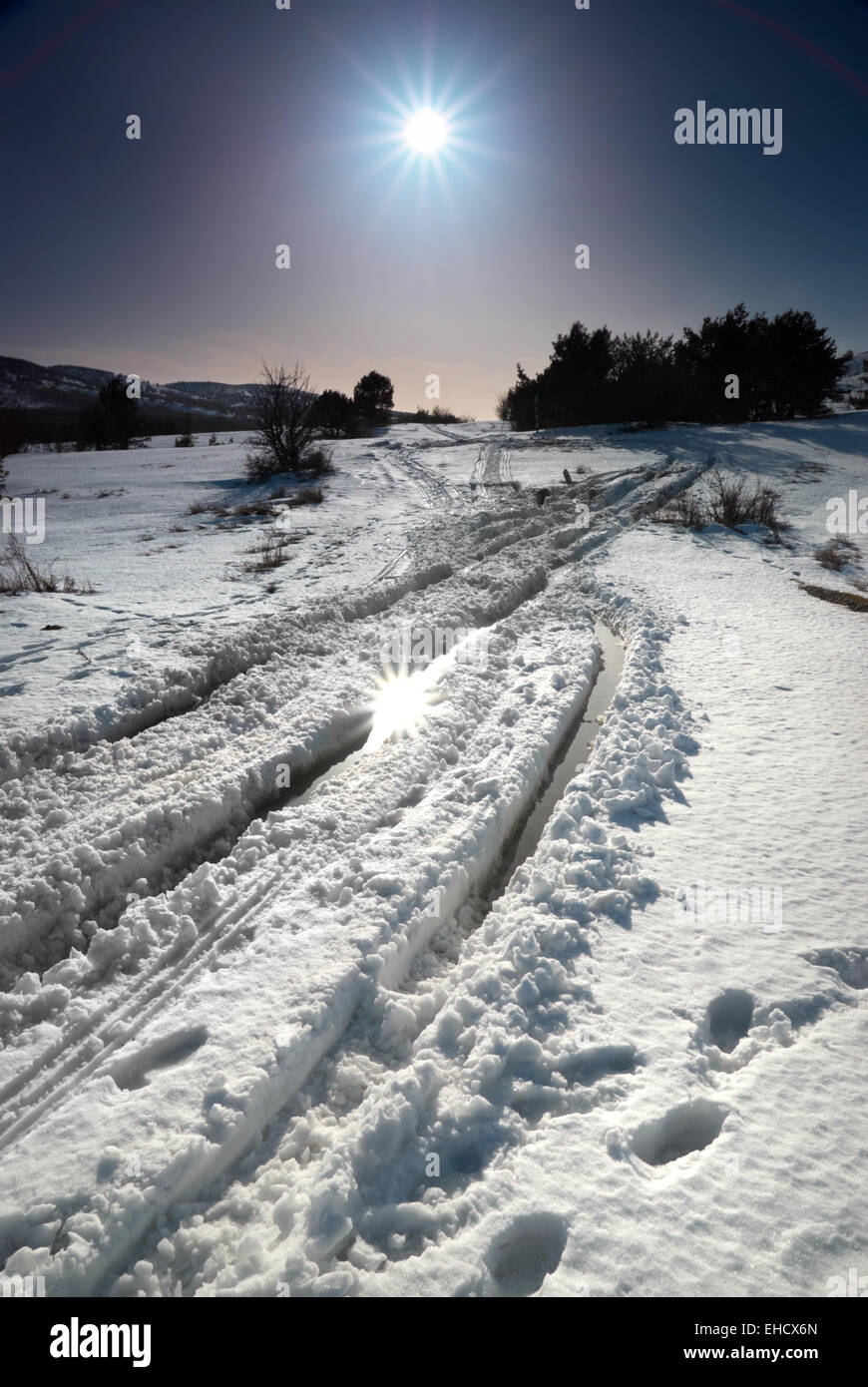 Winter snow road with sunshine star Stock Photo - Alamy
