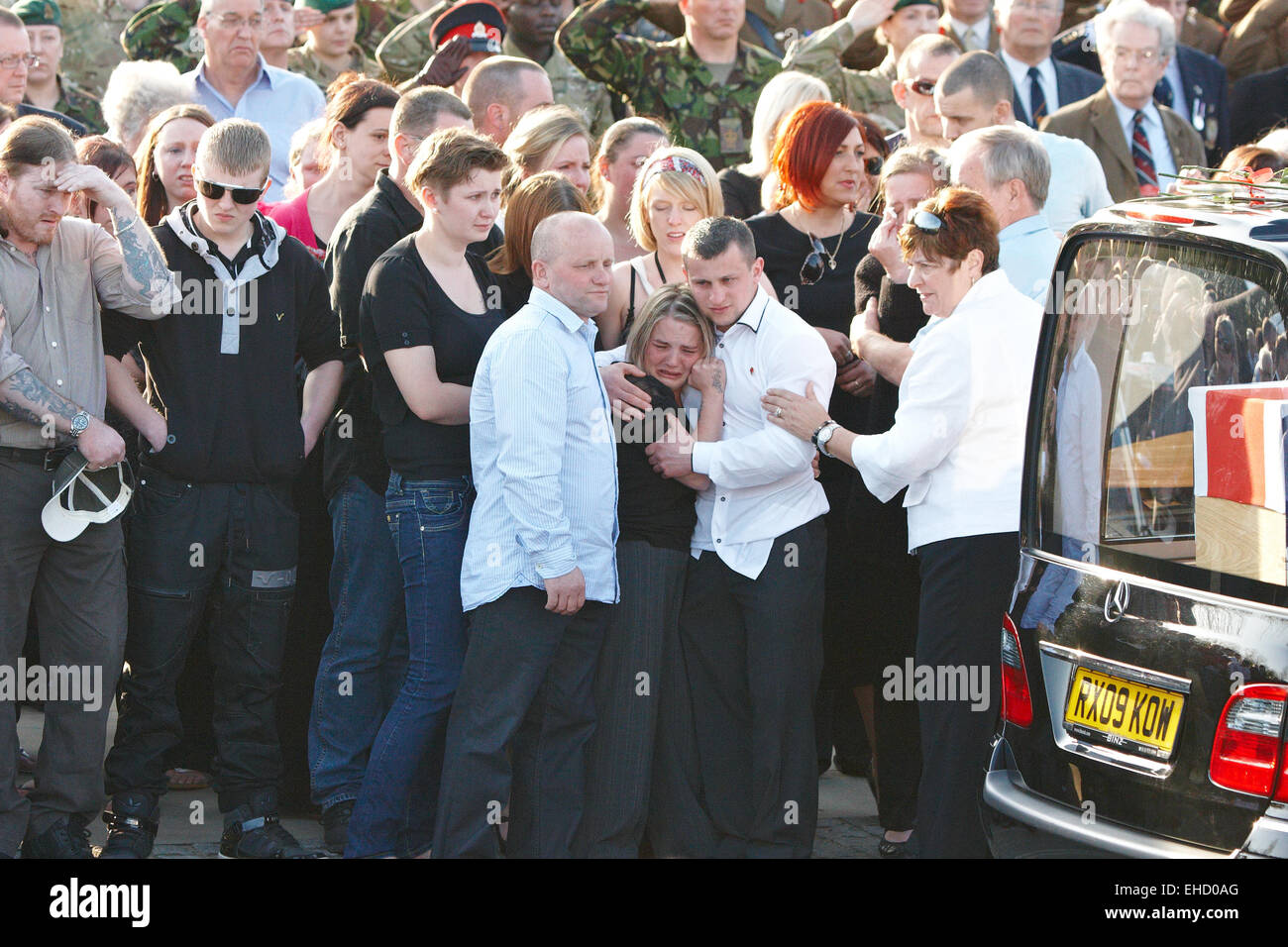 Friends and family of L/Cpl Michael Foley pay their respects during the ...