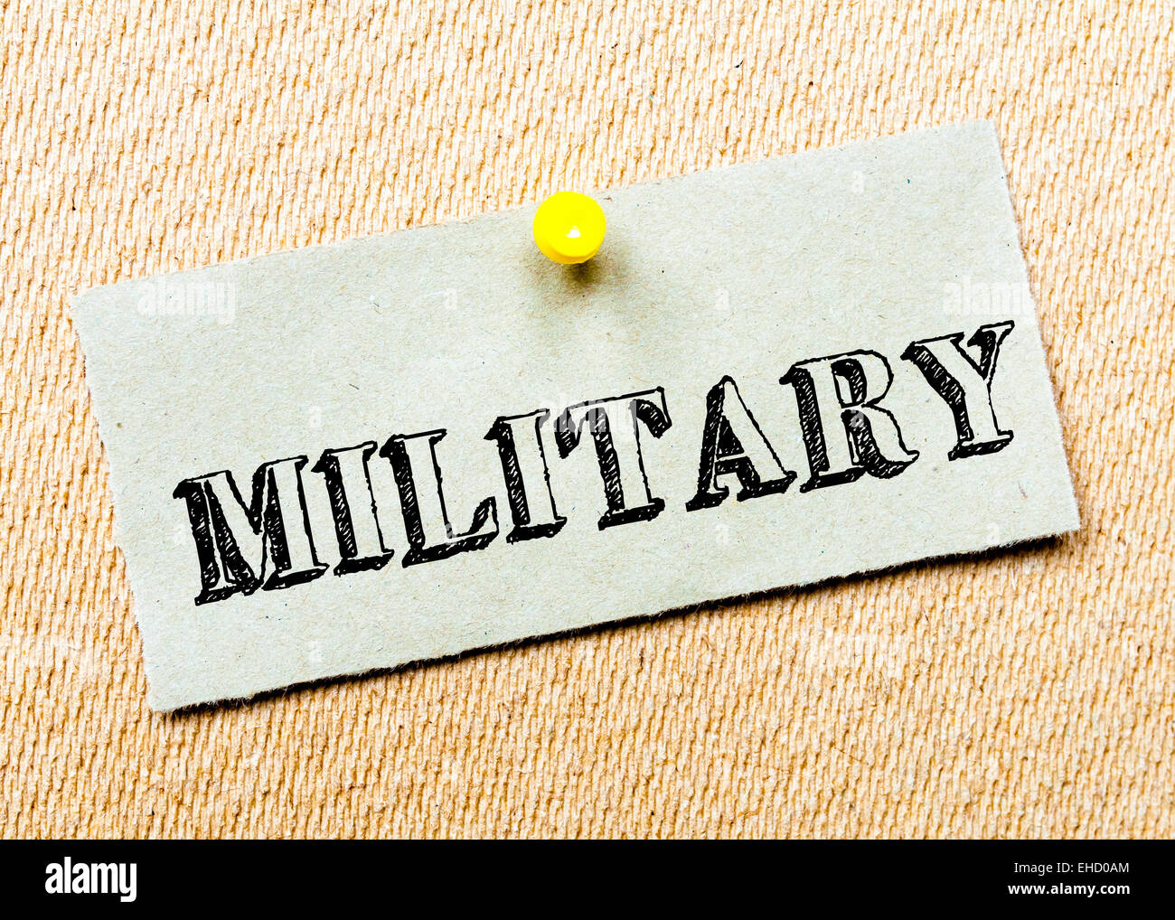 Recycled paper note pinned on cork board. Military Message. Concept ...