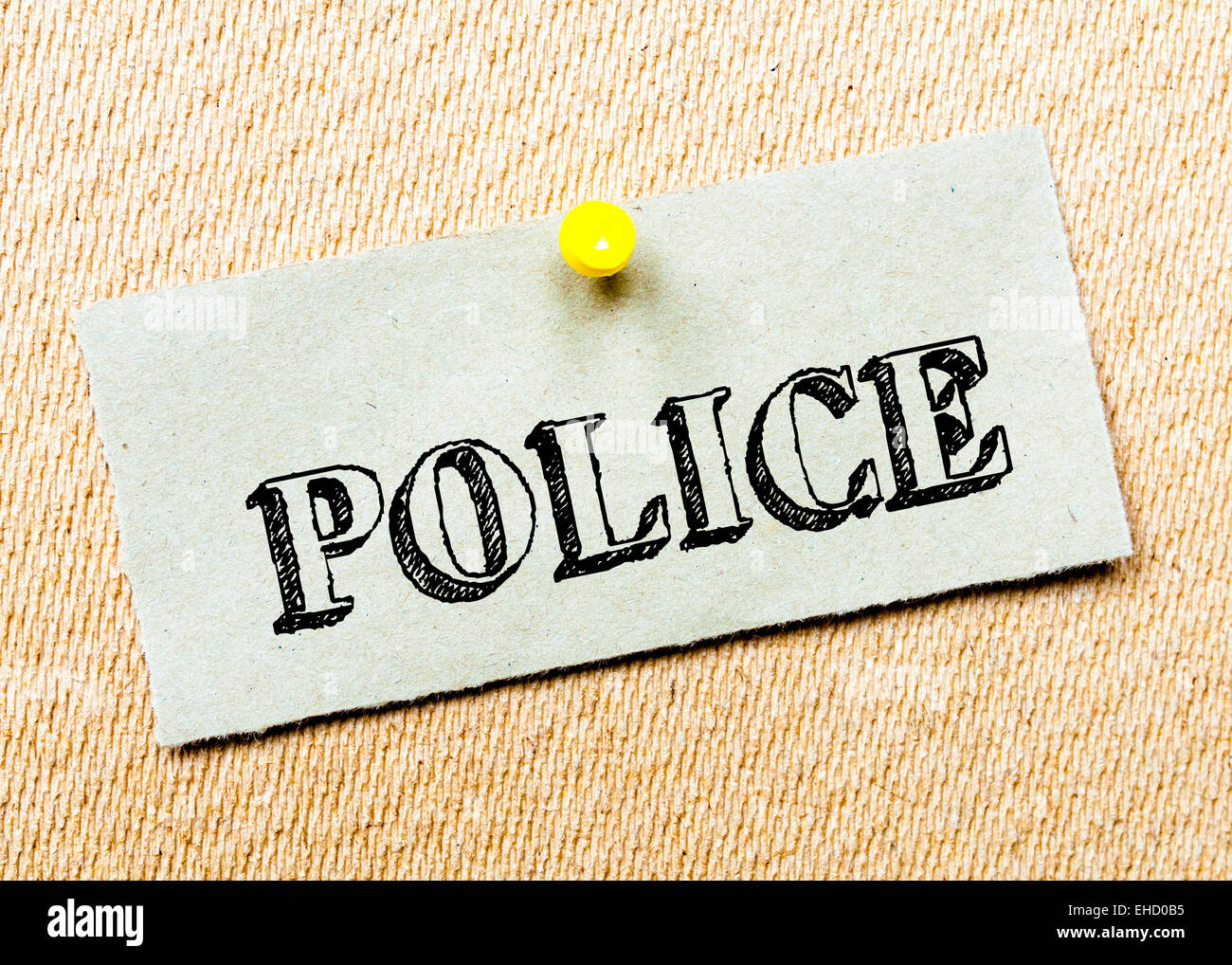 Recycled paper note pinned on cork board. Police Message. Concept Image ...