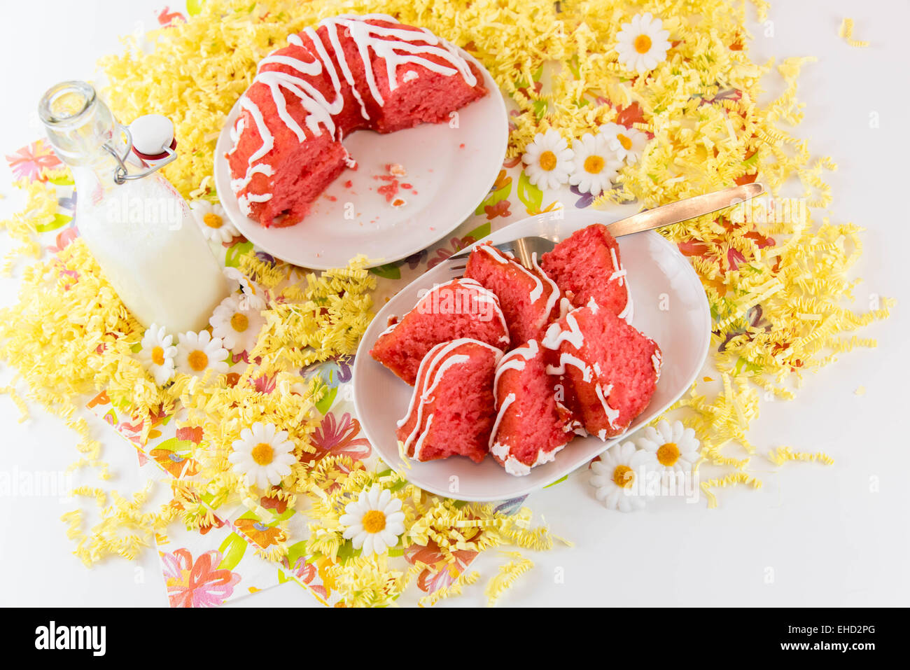 pink cherry pudding cake and a jug of milk Stock Photo - Alamy