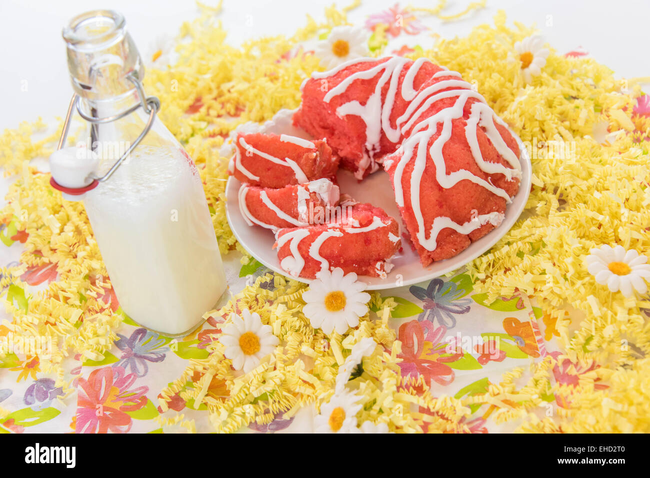 pink cherry pudding cake and a jug of milk Stock Photo - Alamy
