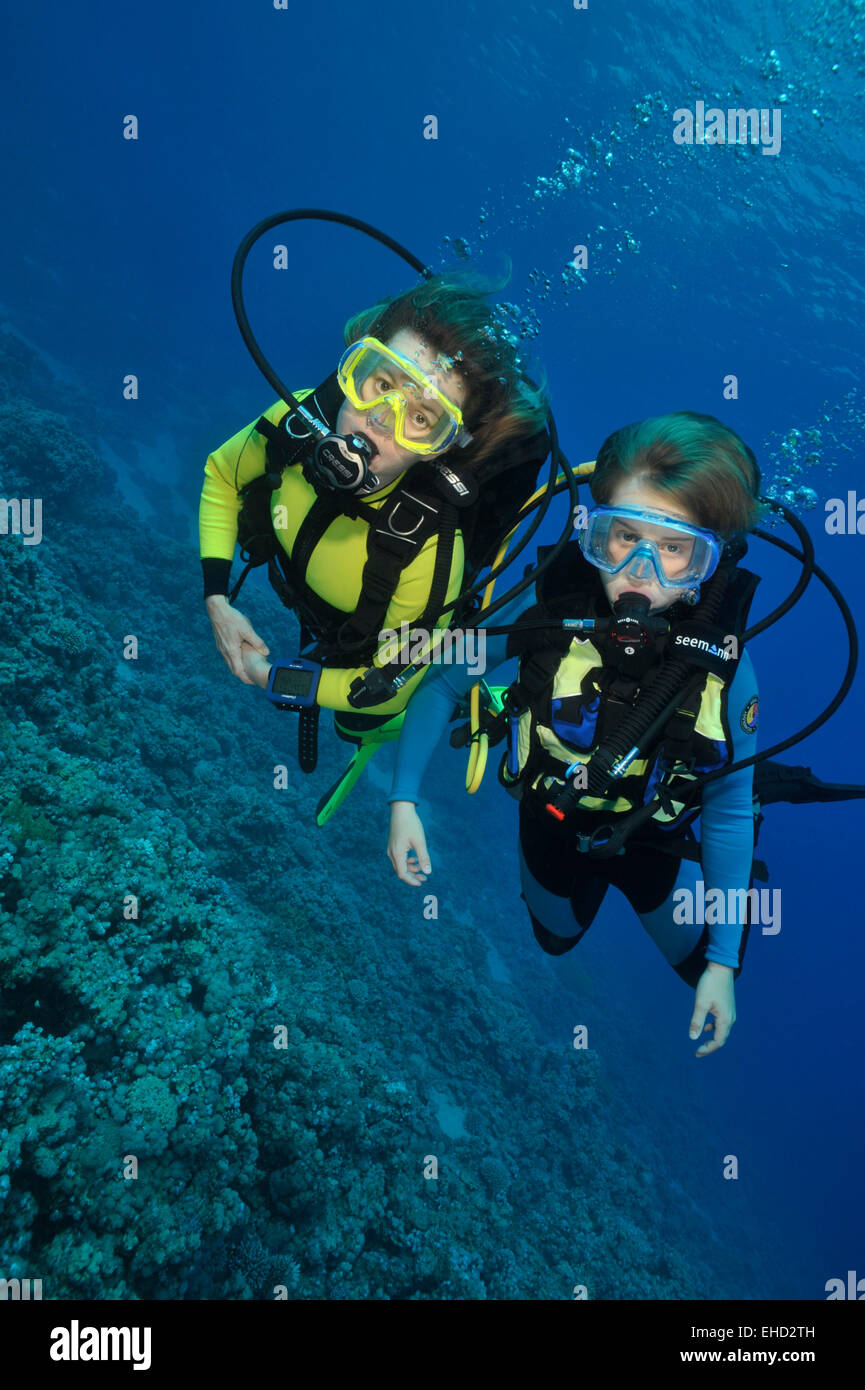 Mother and son diving Stock Photo - Alamy