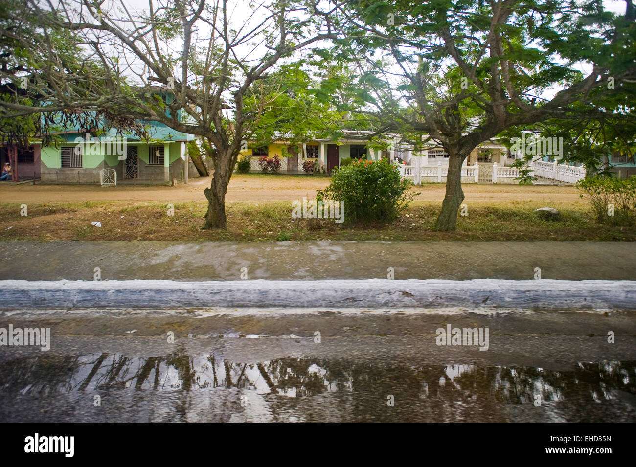 Horizontal view of a typical street in Cuba after rain Stock Photo - Alamy