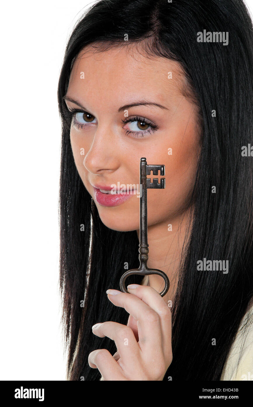 Woman with house key Stock Photo - Alamy