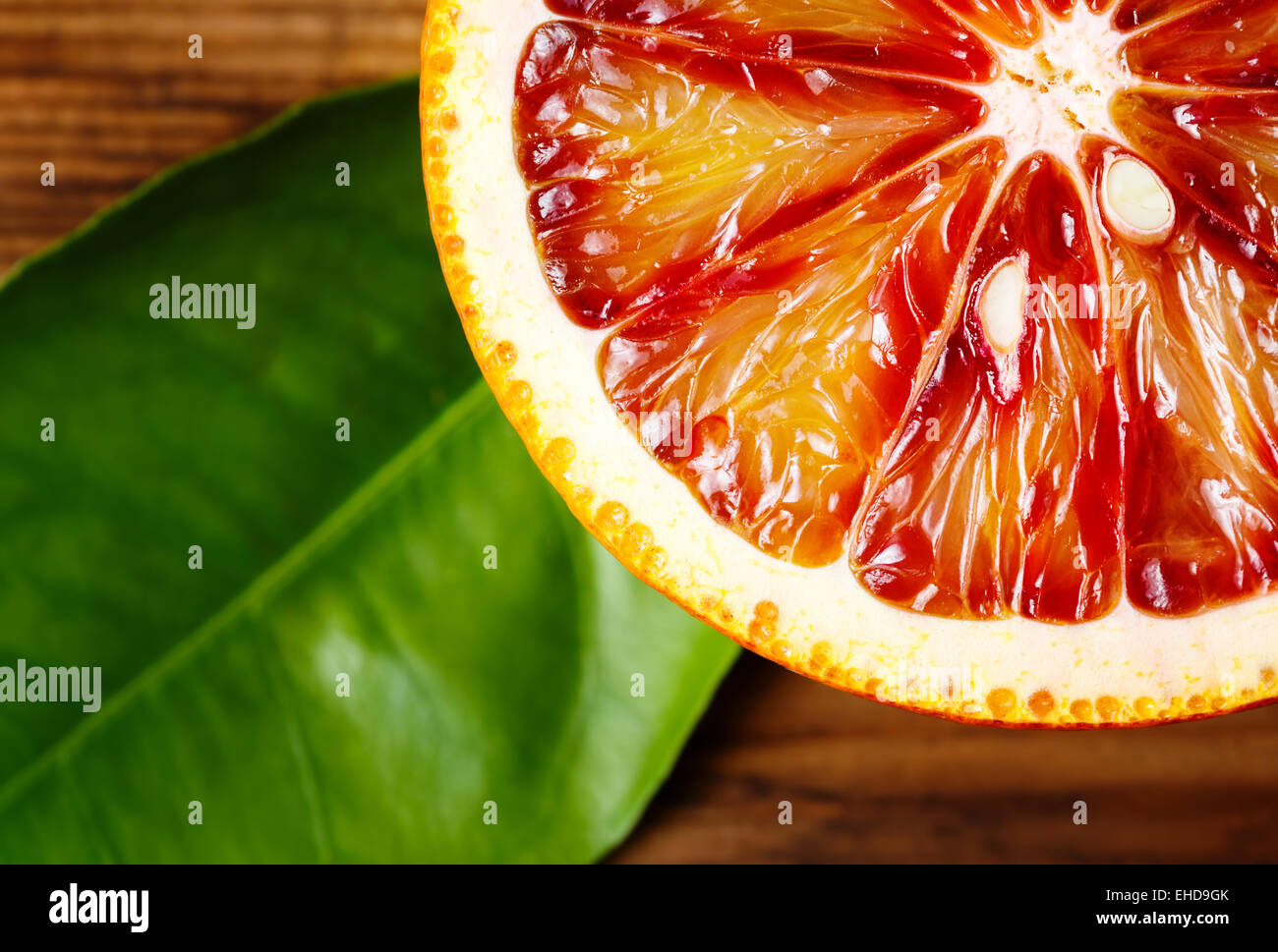 Blood orange fruit close up on wooden table. Top view Stock Photo - Alamy