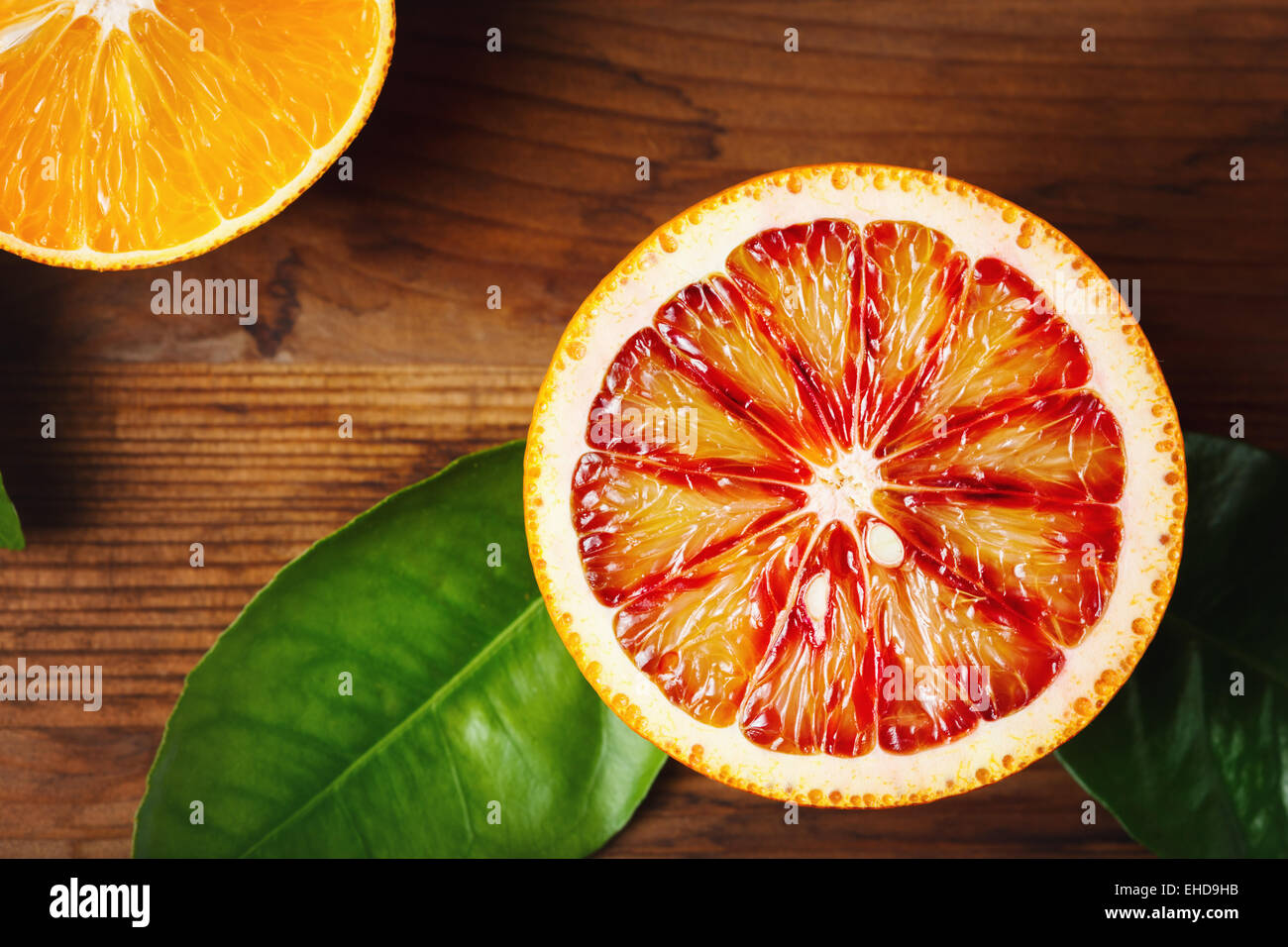 Blood orange fruit close up on wooden table. Top view Stock Photo - Alamy
