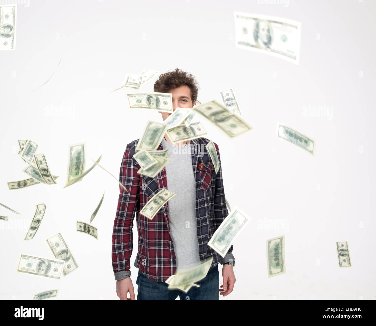 Casual man throwing Money Into Air over gray background Stock Photo - Alamy