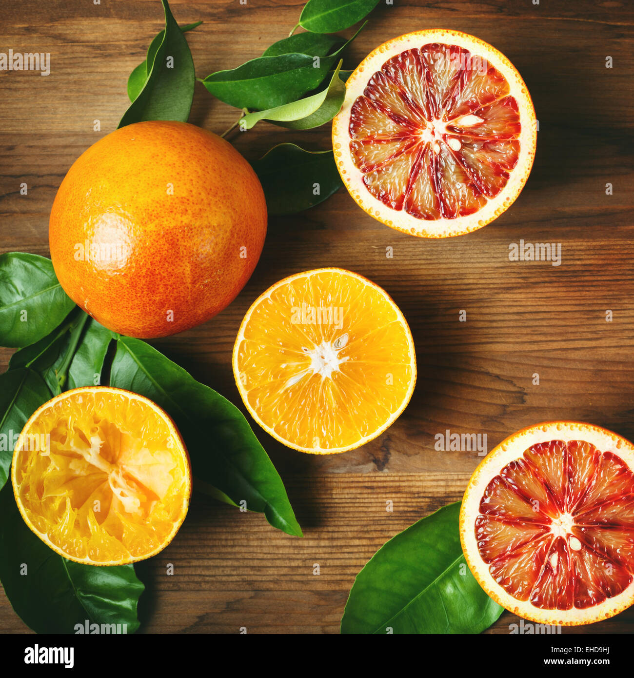 Different sort of orange fruit on wooden table. Top view. Instagram ...