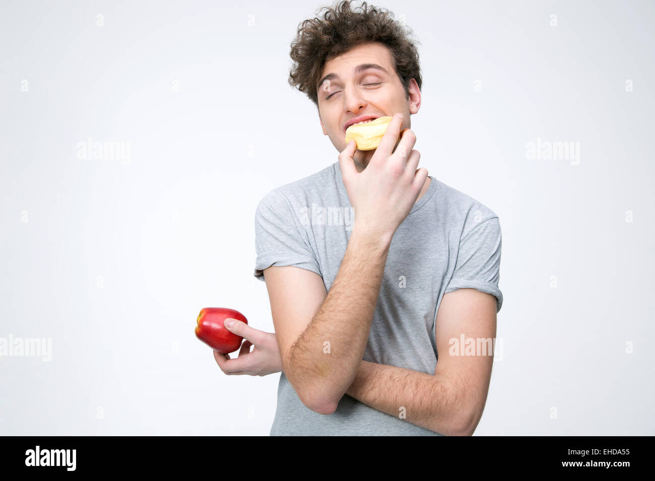 Young student eating apple isolated hi-res stock photography and images ...