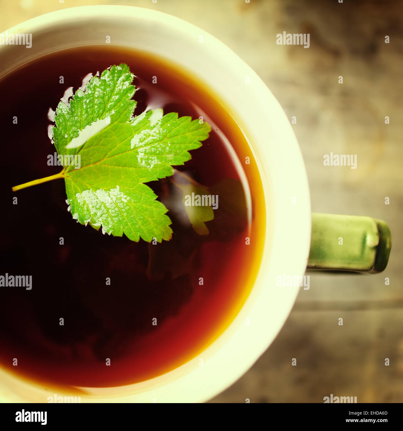 Herbal tea close up with green leaf. Instagram color style. Top view ...