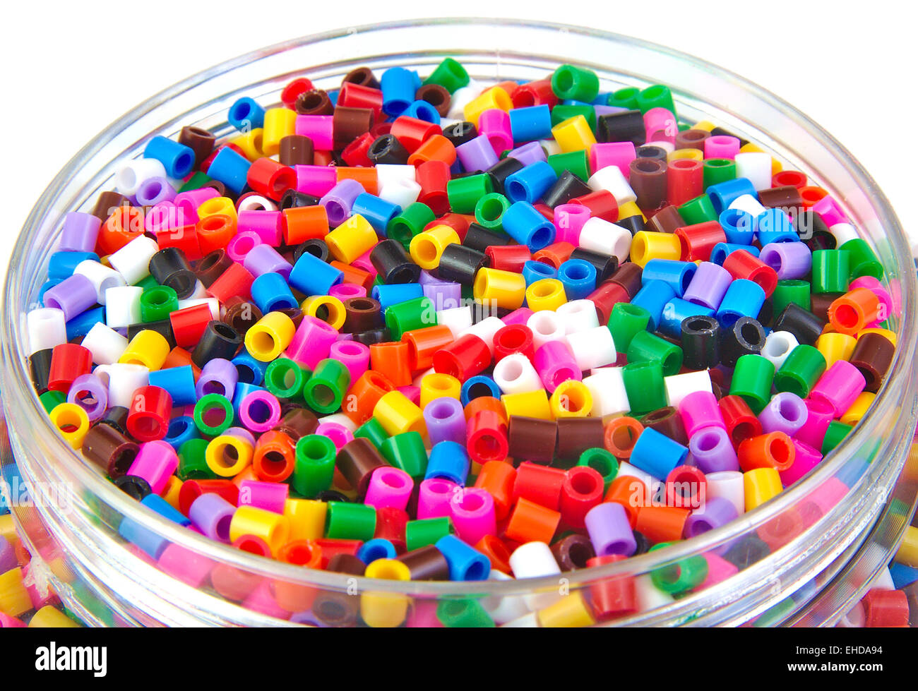 Bunch of colourful plastic small cylinders toys Stock Photo - Alamy