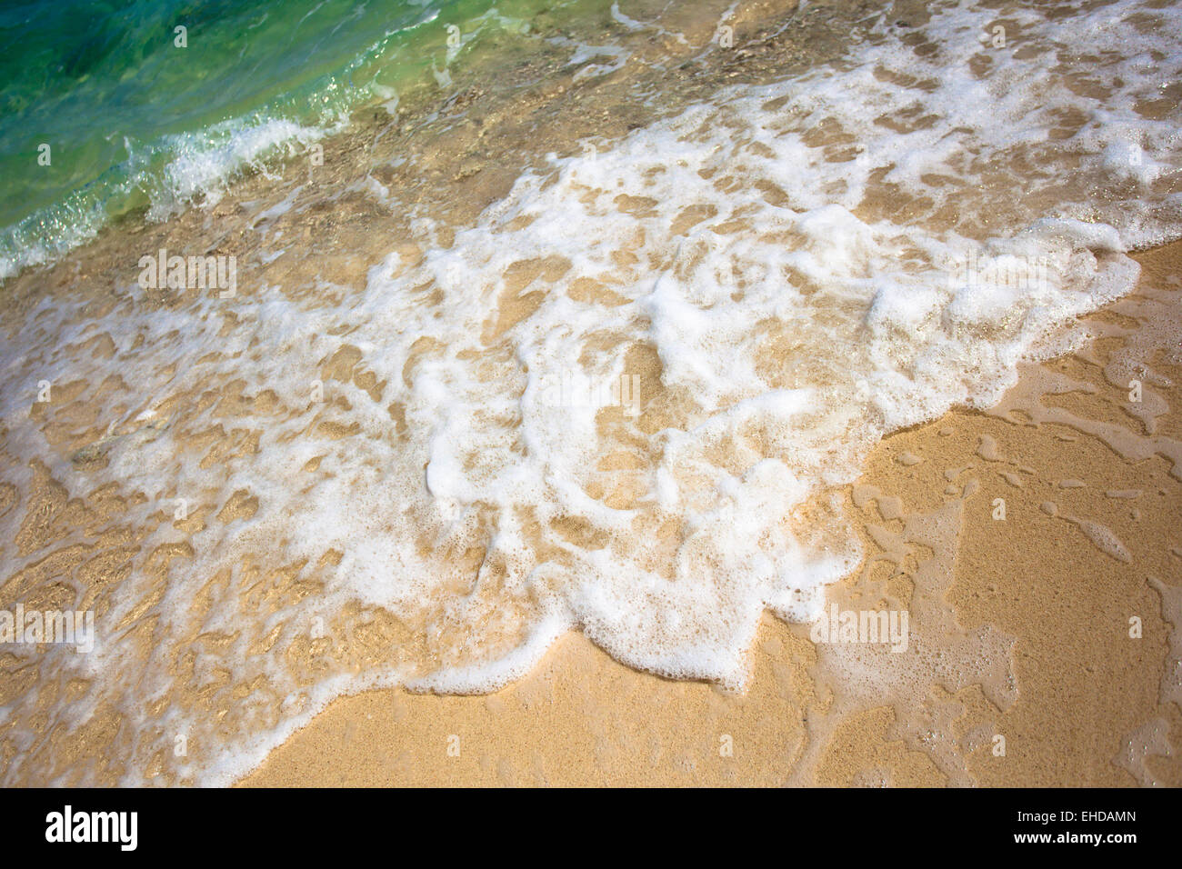 Waves on sand near tropic sea Stock Photo - Alamy
