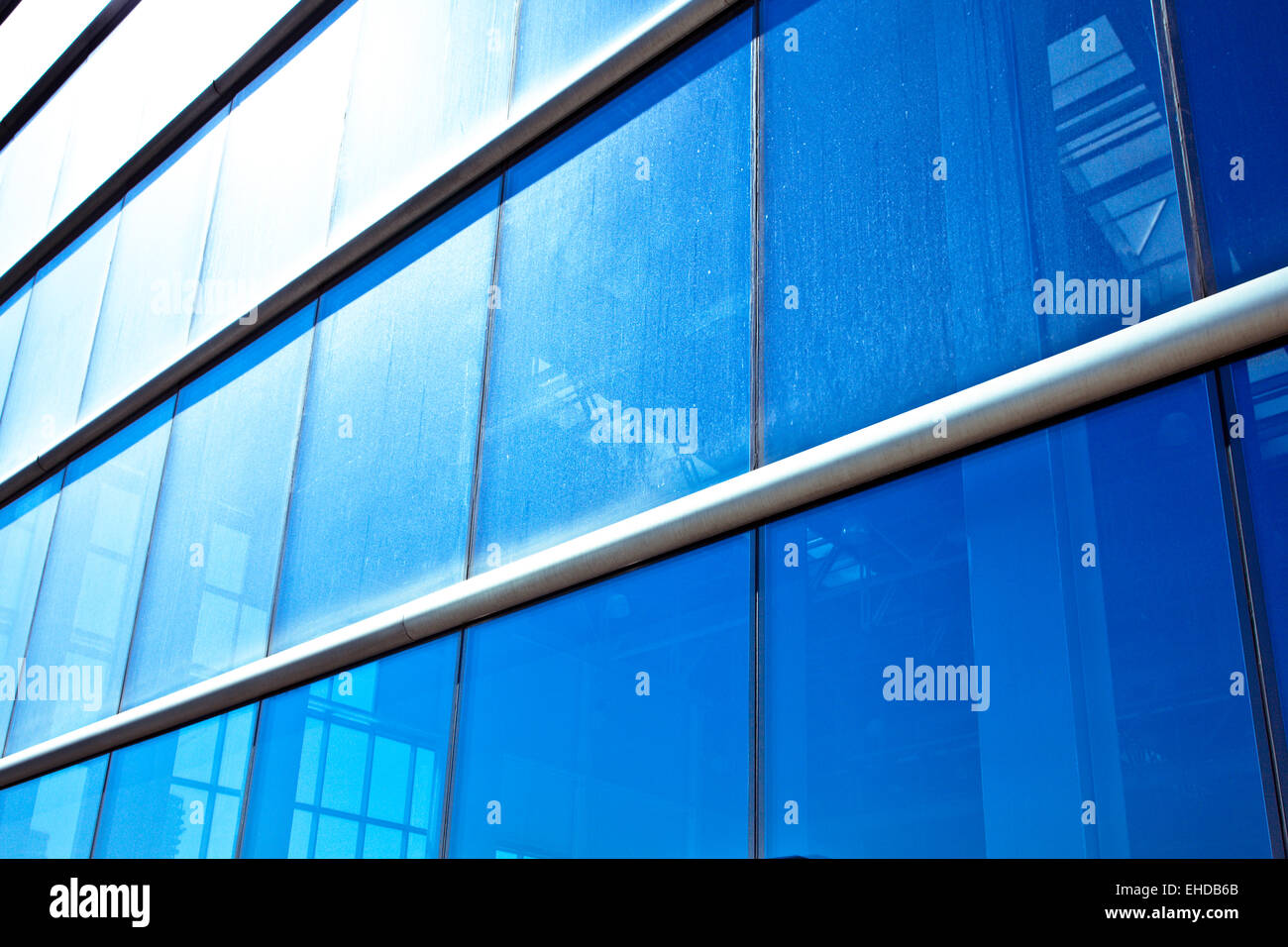 Modern blue office building wall Stock Photo - Alamy