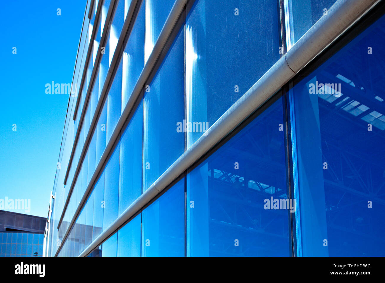 Modern blue office building wall Stock Photo - Alamy