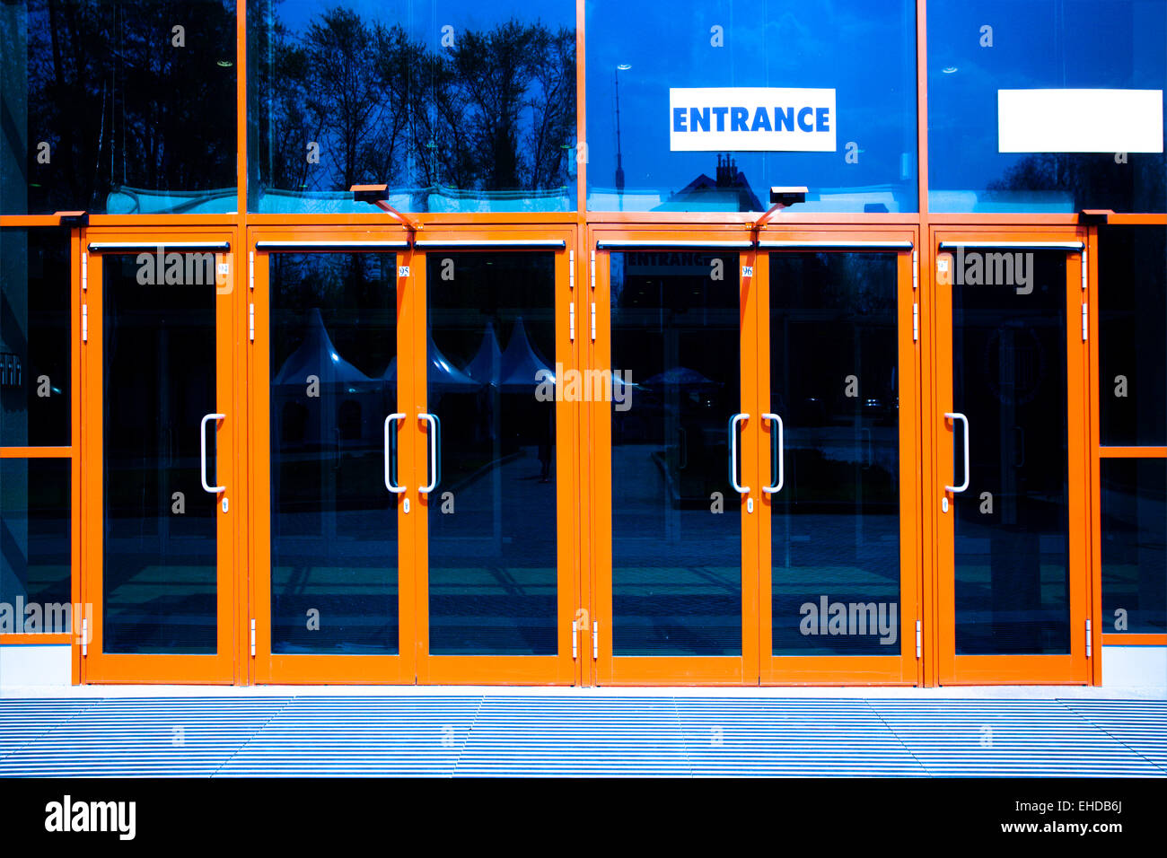 orange doors of modern trade center Stock Photo - Alamy