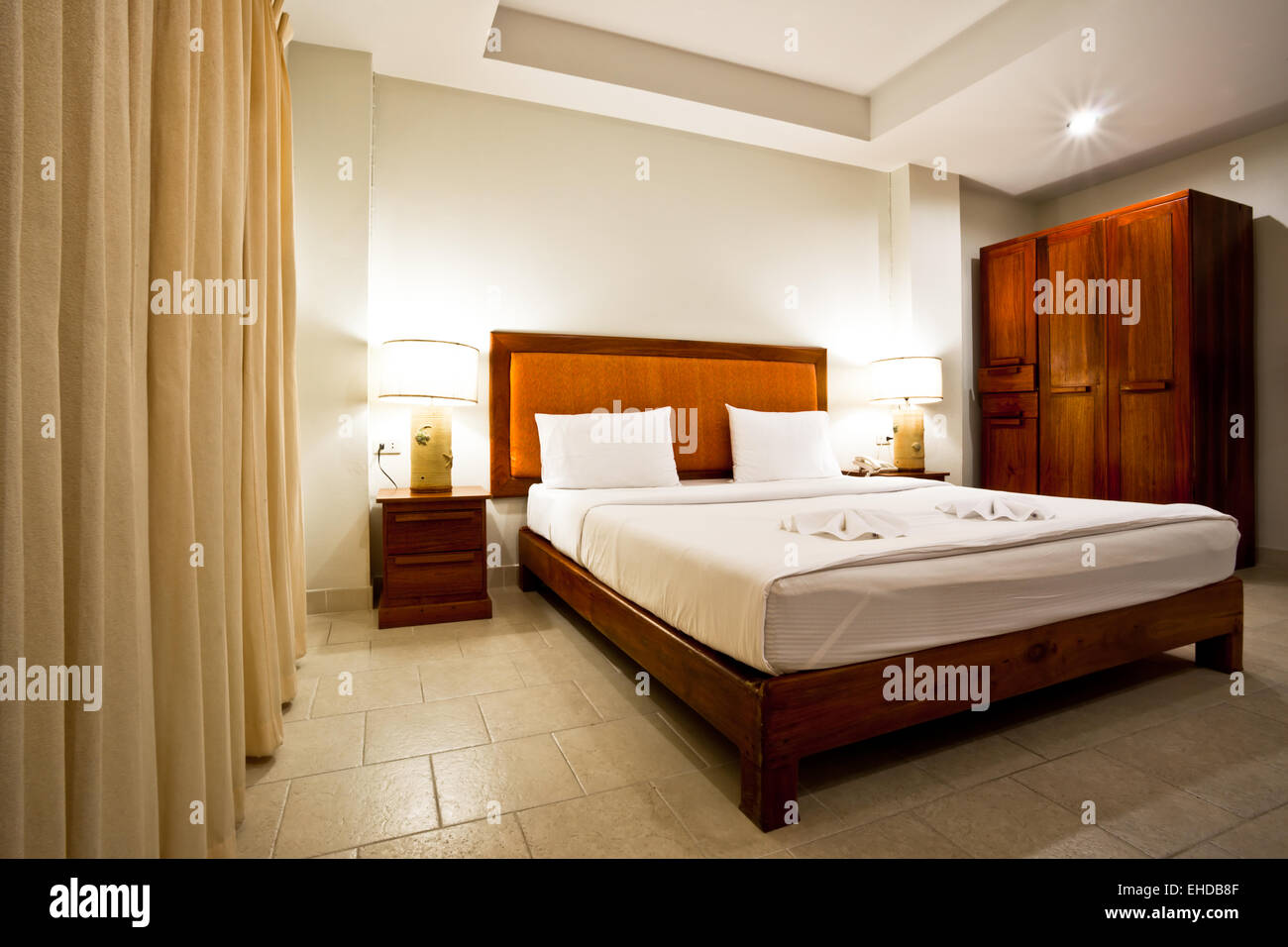 Hotel bedroom interior in evening Stock Photo - Alamy