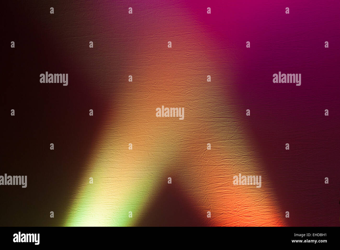 Colourful spotlights against a textured background Stock Photo - Alamy