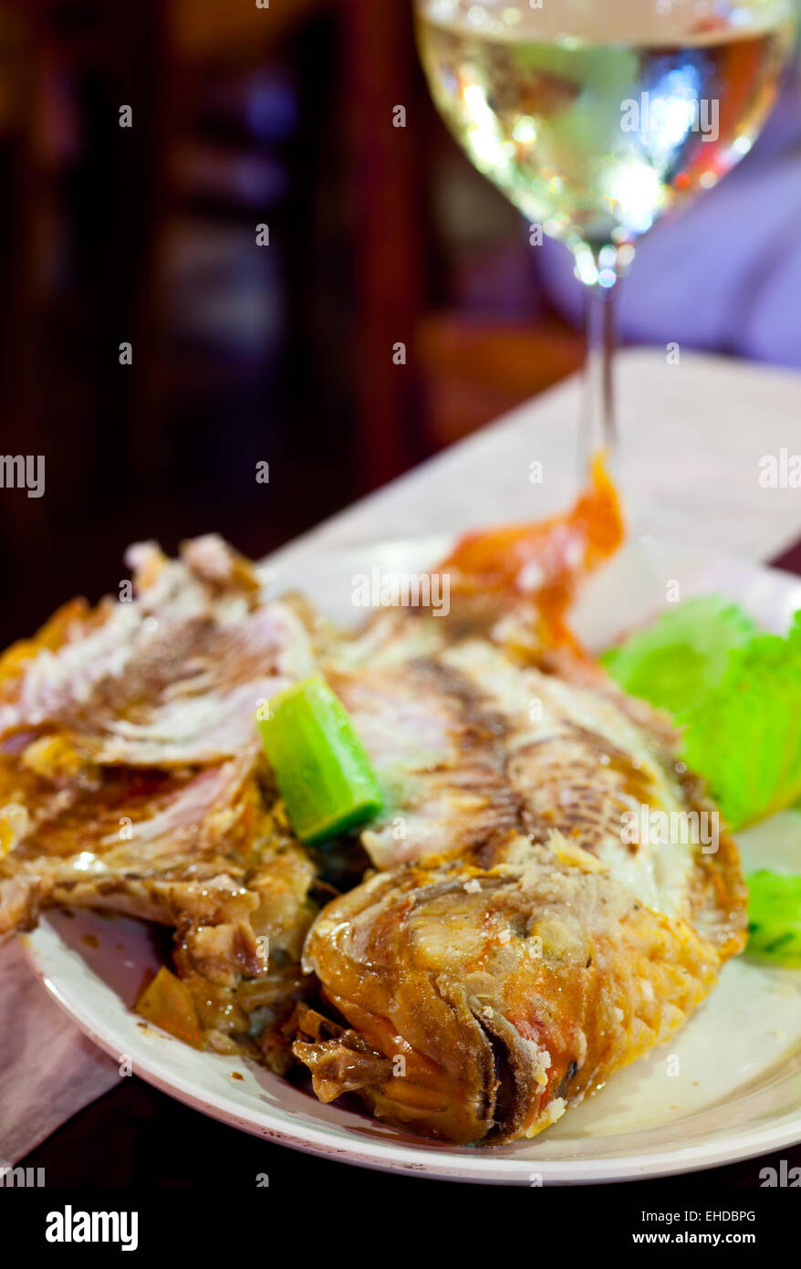 Fried fish on grill in salt Stock Photo - Alamy