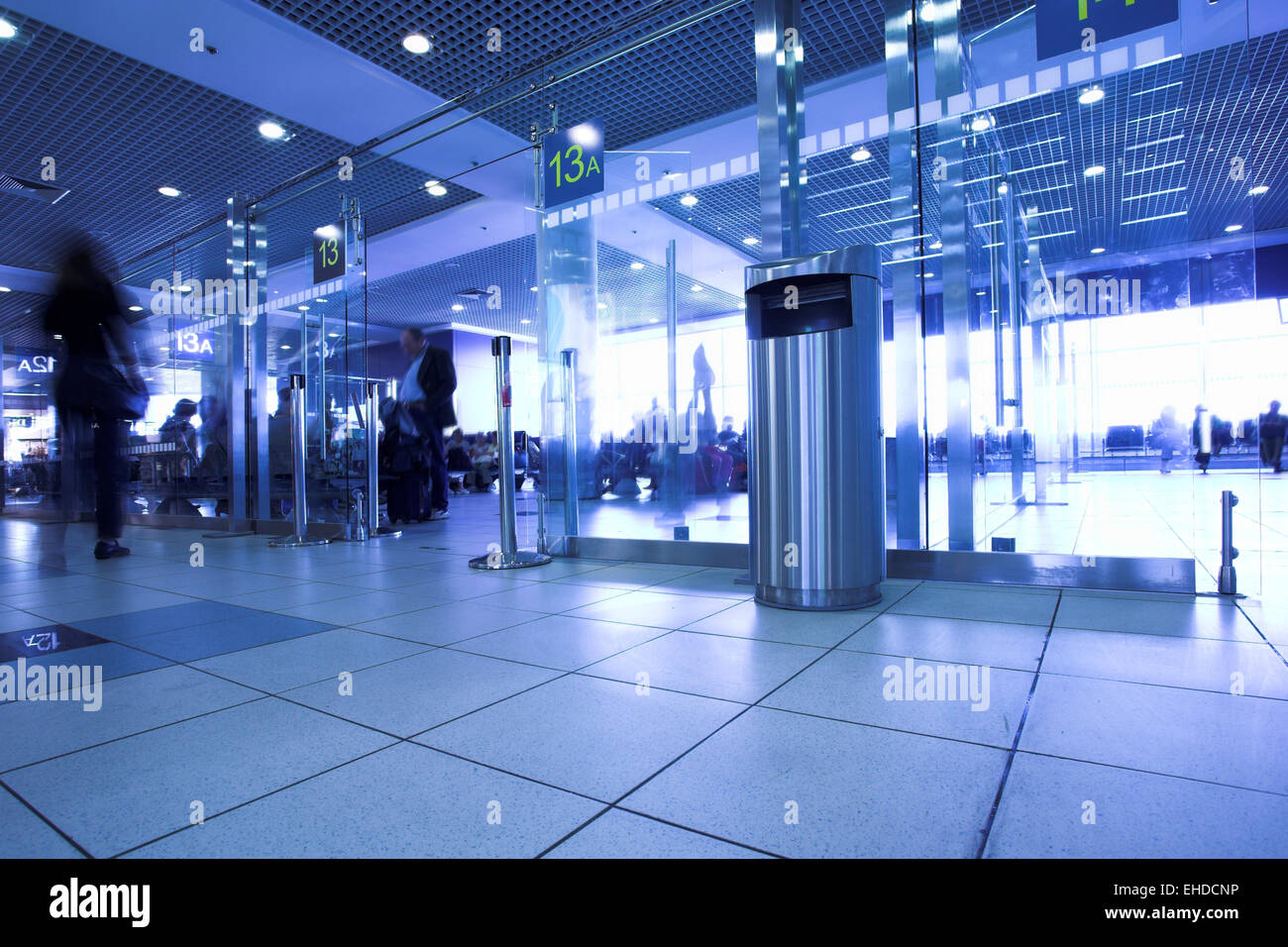 Blue gates in airport terminal Stock Photo - Alamy