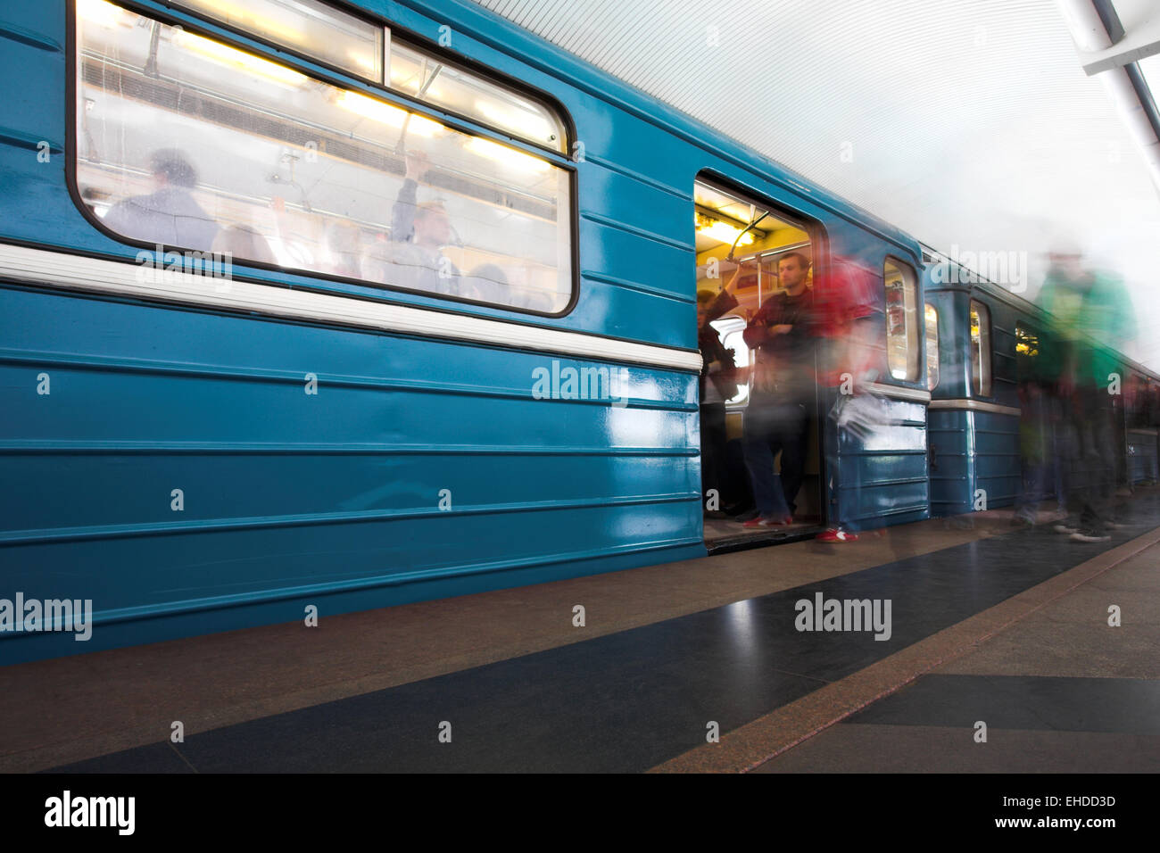 Blue train at subway hall platform Stock Photo - Alamy