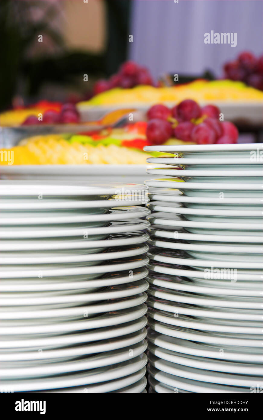 Plates and different fruits Stock Photo - Alamy