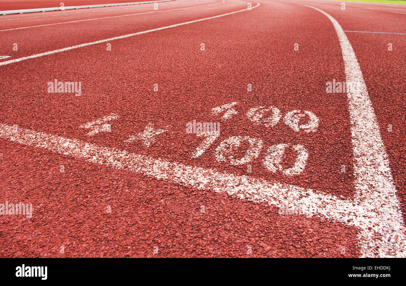 a close up of white line on red racetrack Stock Photo - Alamy