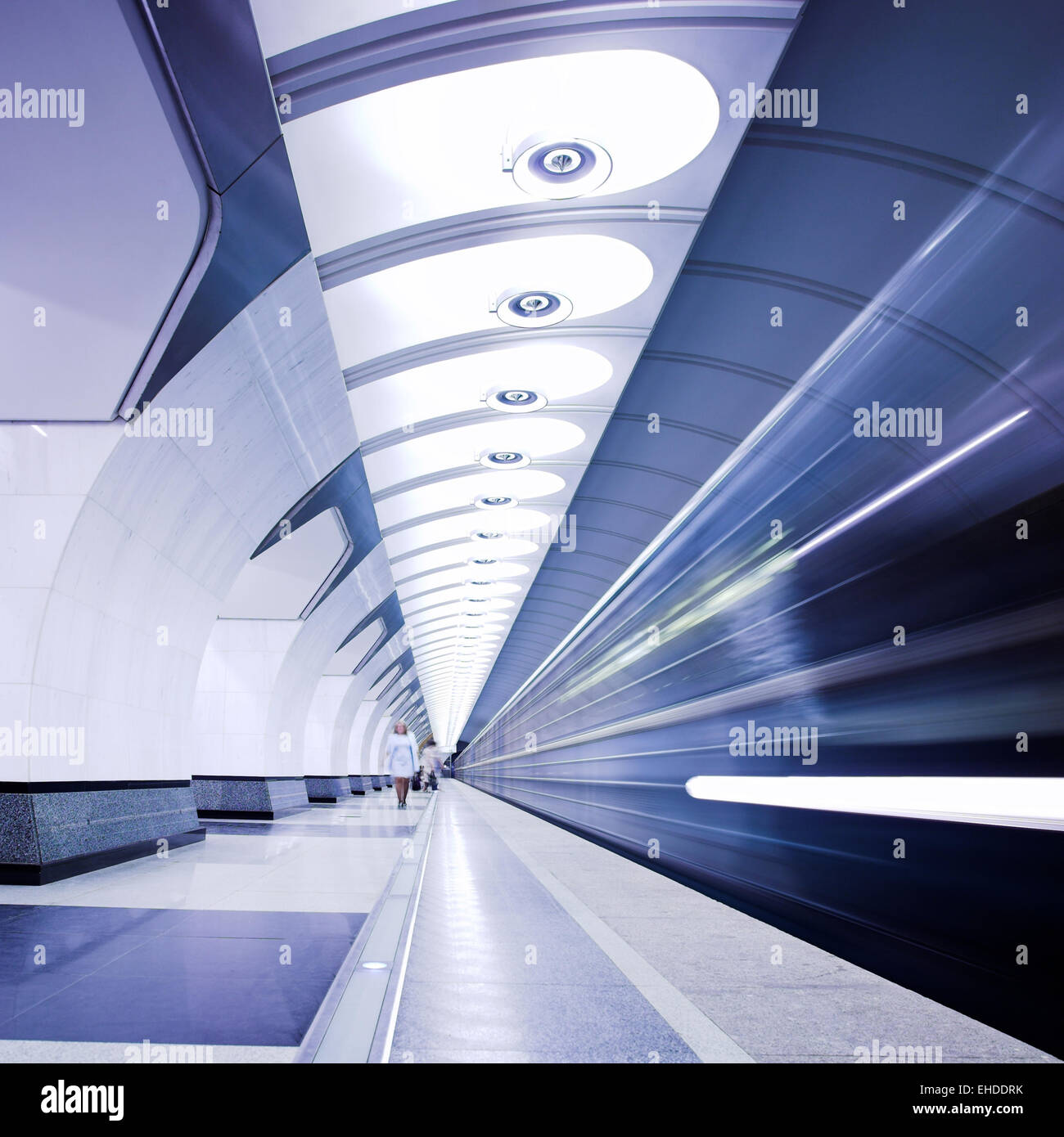 Blue train on platform in subway Stock Photo - Alamy