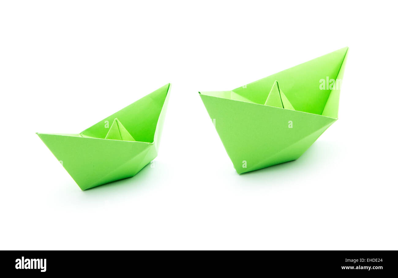 green paper boats isolated on white background Stock Photo - Alamy