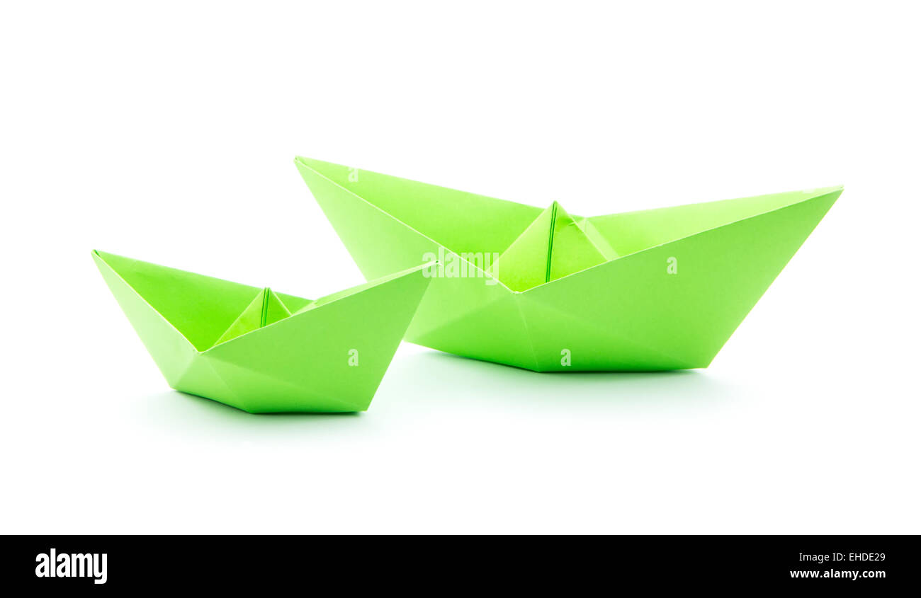 green paper boats isolated on white background Stock Photo - Alamy