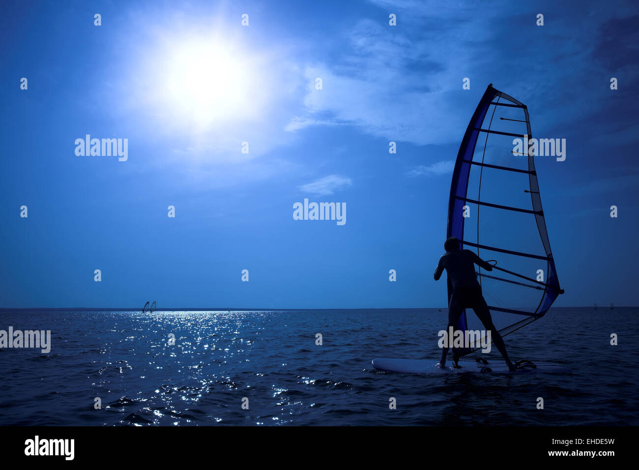 Surfer on sunshine Stock Photo - Alamy