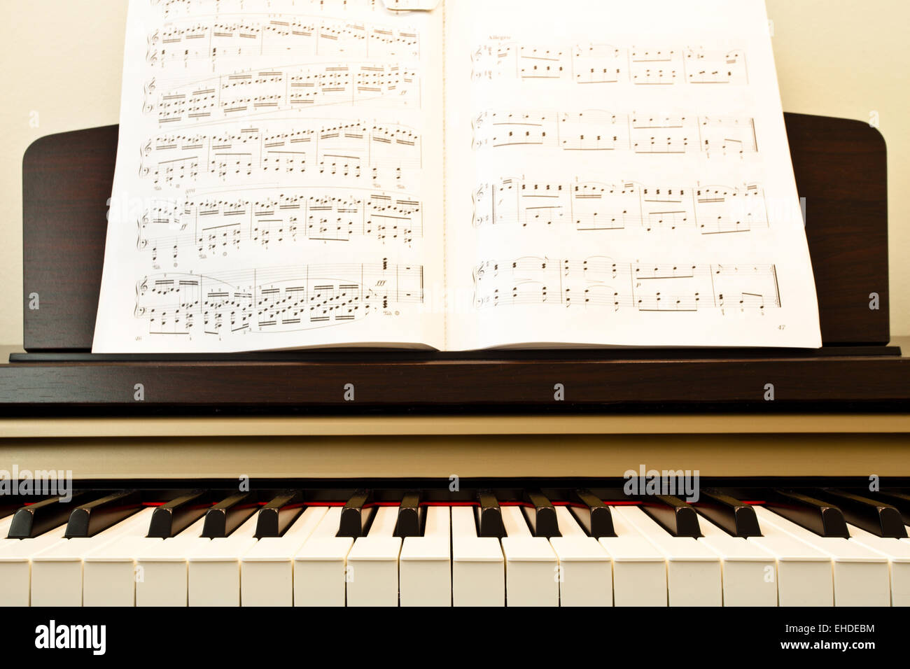 Piano keys and music paper close-up Stock Photo - Alamy