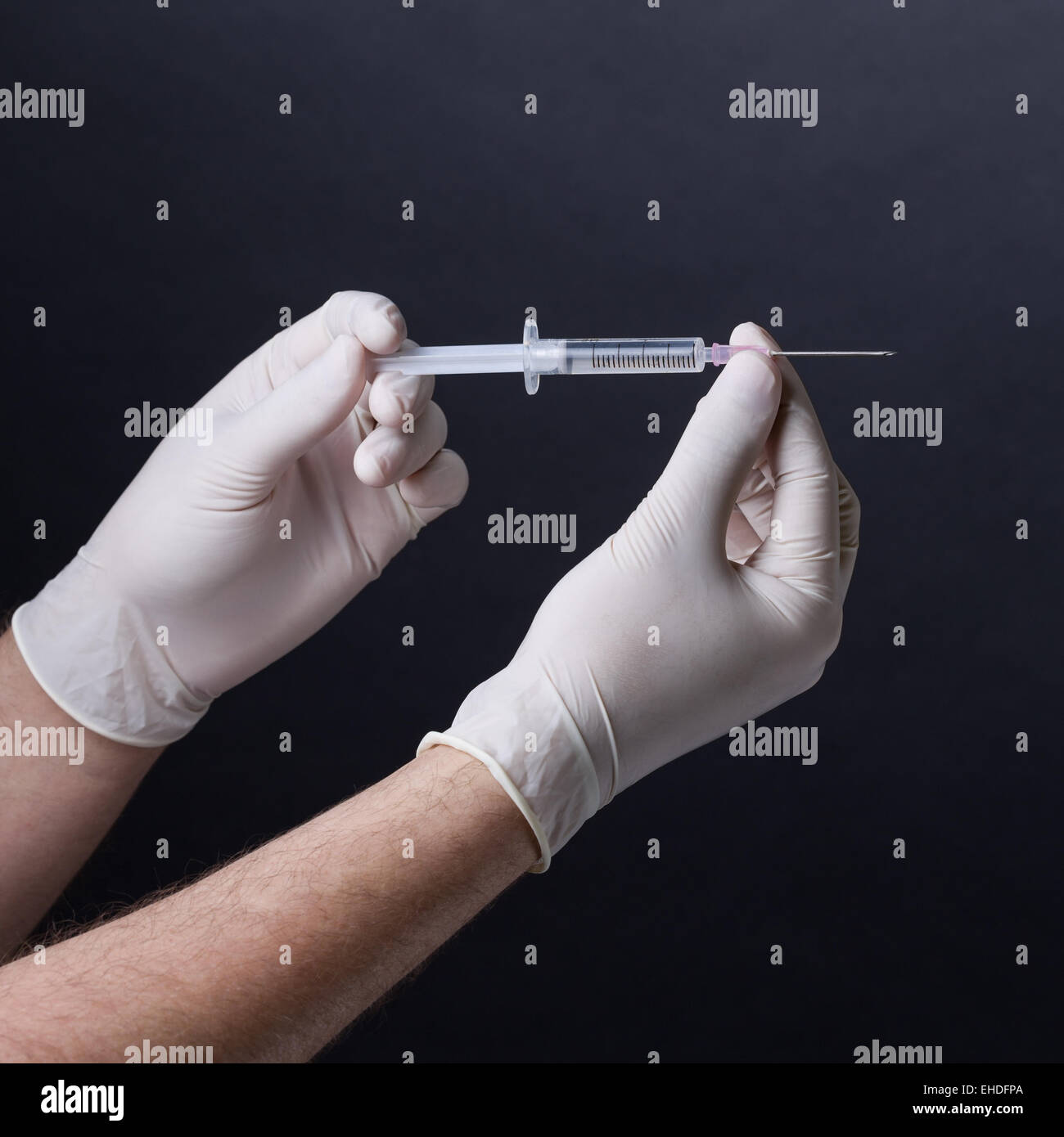 Hands with syringe Stock Photo - Alamy