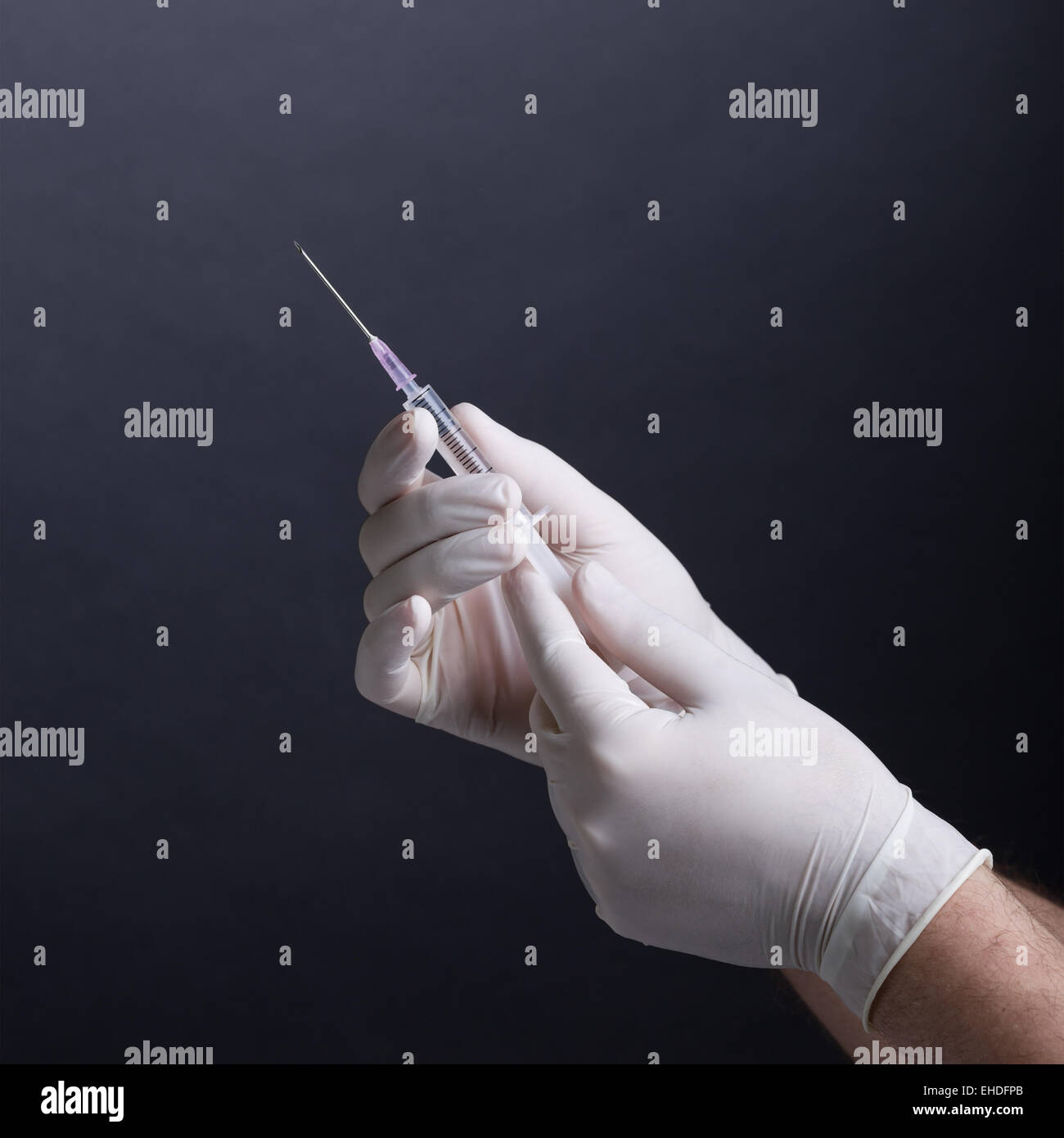 Hands with syringe Stock Photo - Alamy