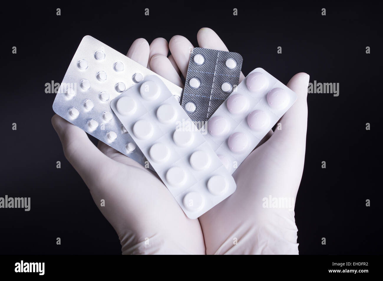Hand with pills blisters Stock Photo - Alamy