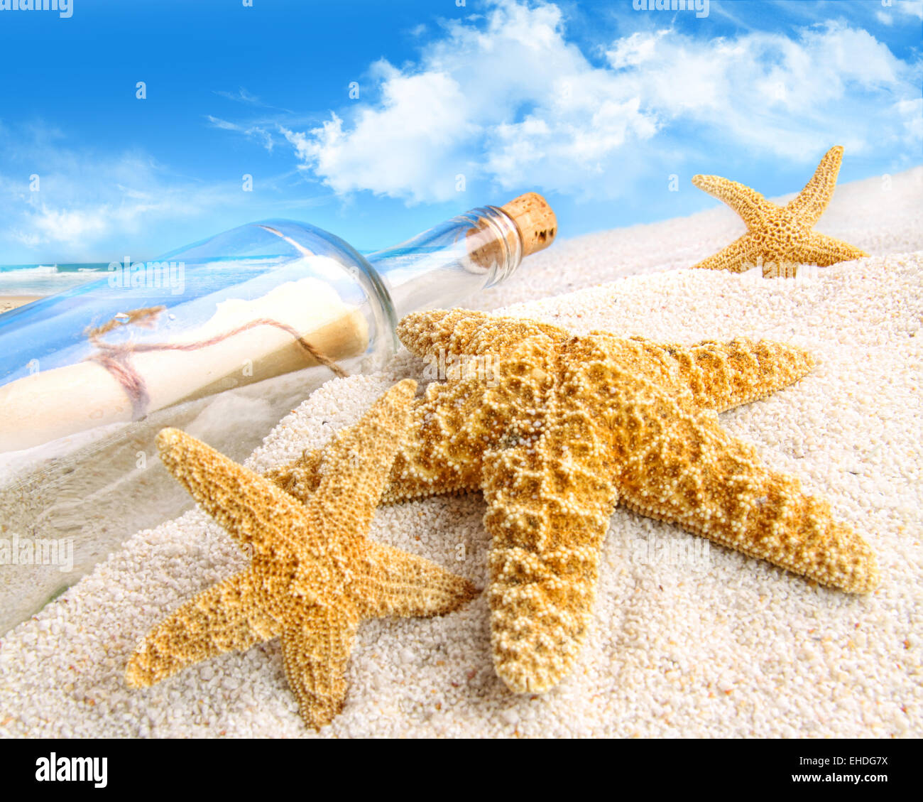 Message in a bottle buried in sand Stock Photo - Alamy