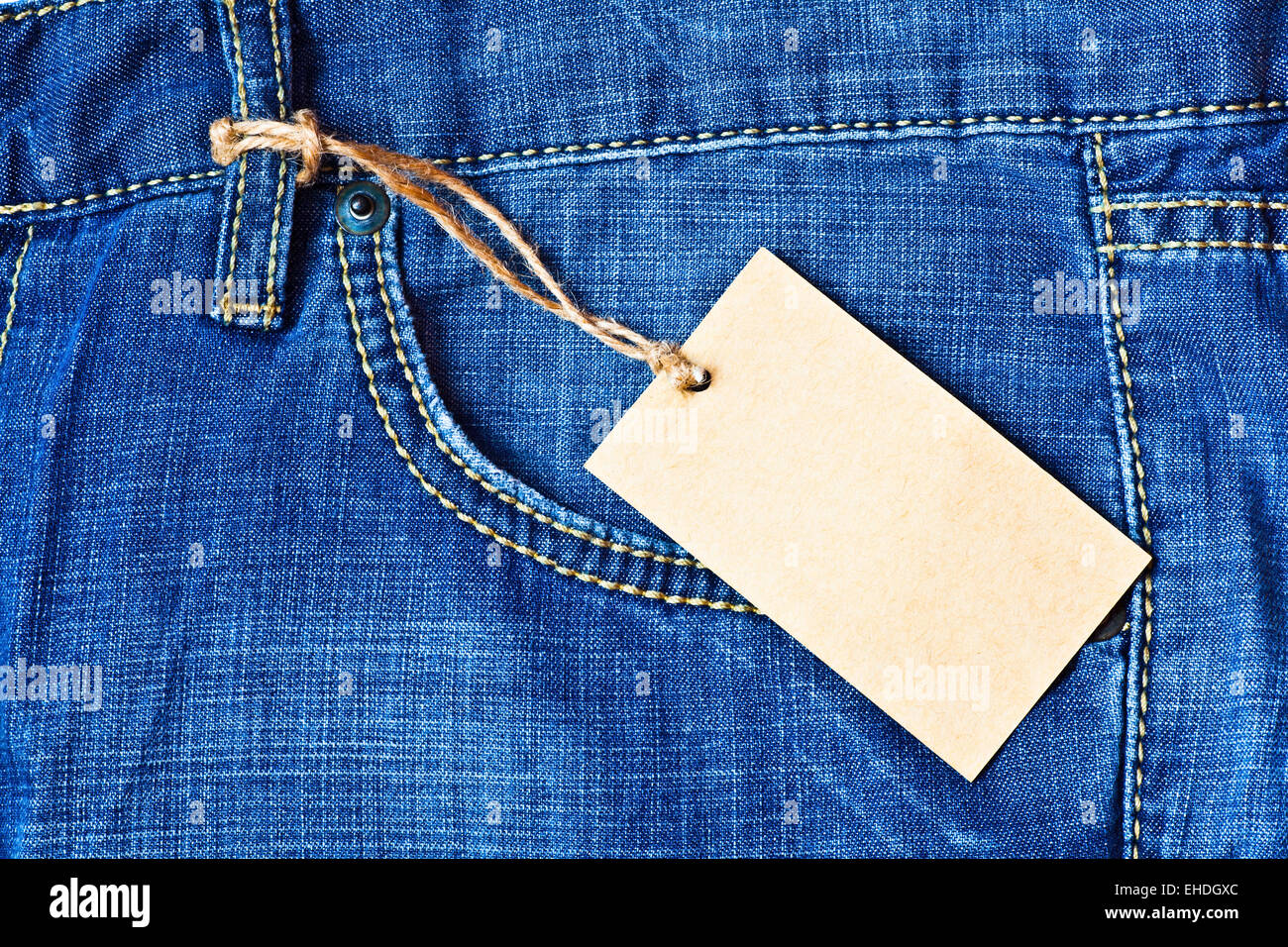 Blue jeans pocket with blank label Stock Photo - Alamy