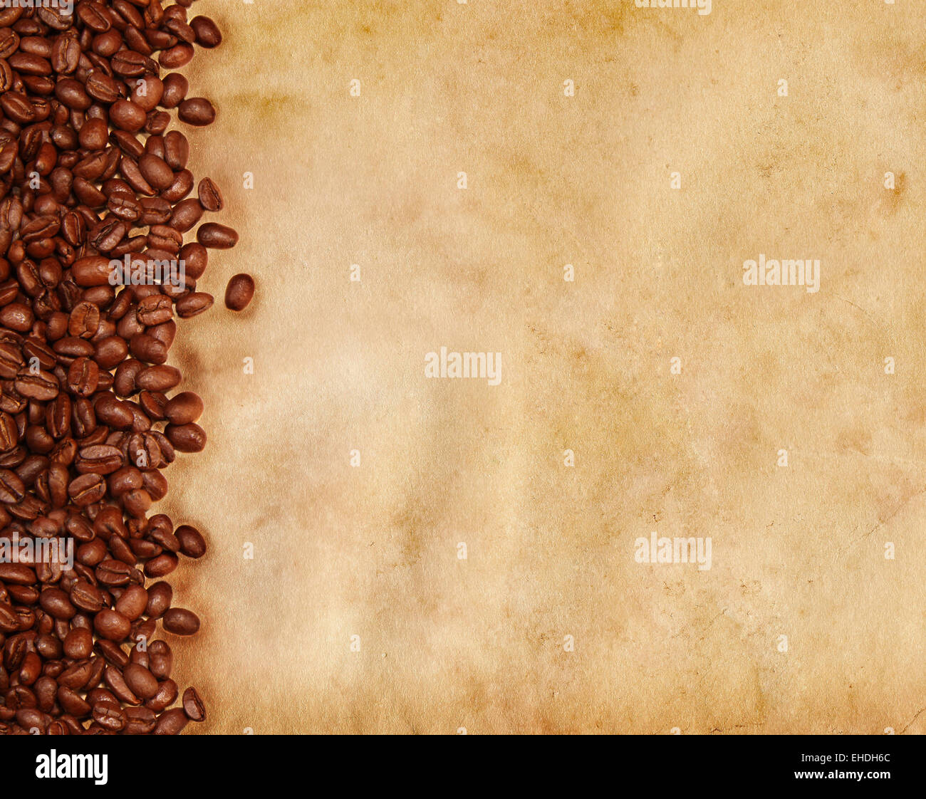 Coffee beans on old parchment paper Stock Photo - Alamy