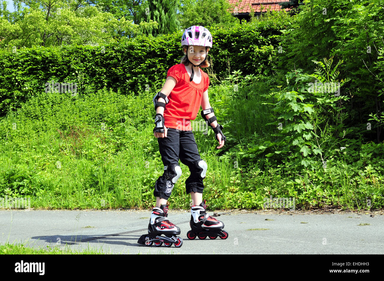 Inline Skating girl Stock Photo - Alamy