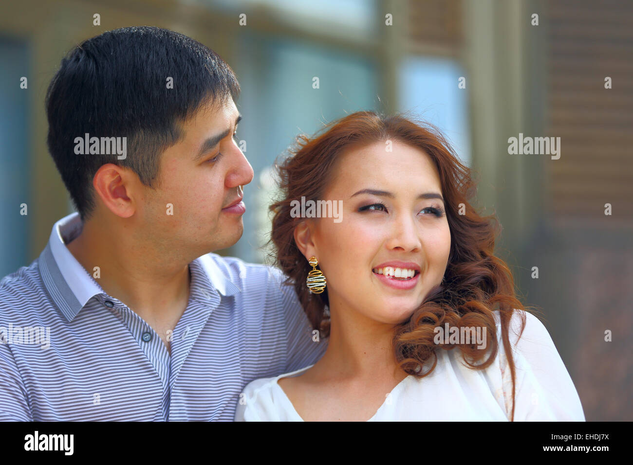 Asian couple together looking to future Stock Photo - Alamy