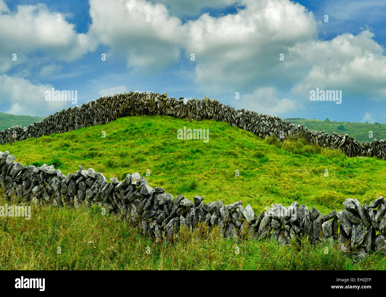 Rock fence and clouds in The Burren. Ireland Stock Photo - Alamy