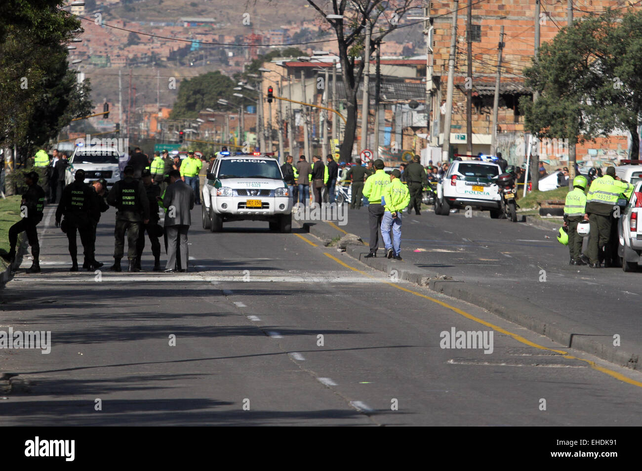 Bogota. 12th Mar, 2015. Policemen stand guard at the blast site in ...