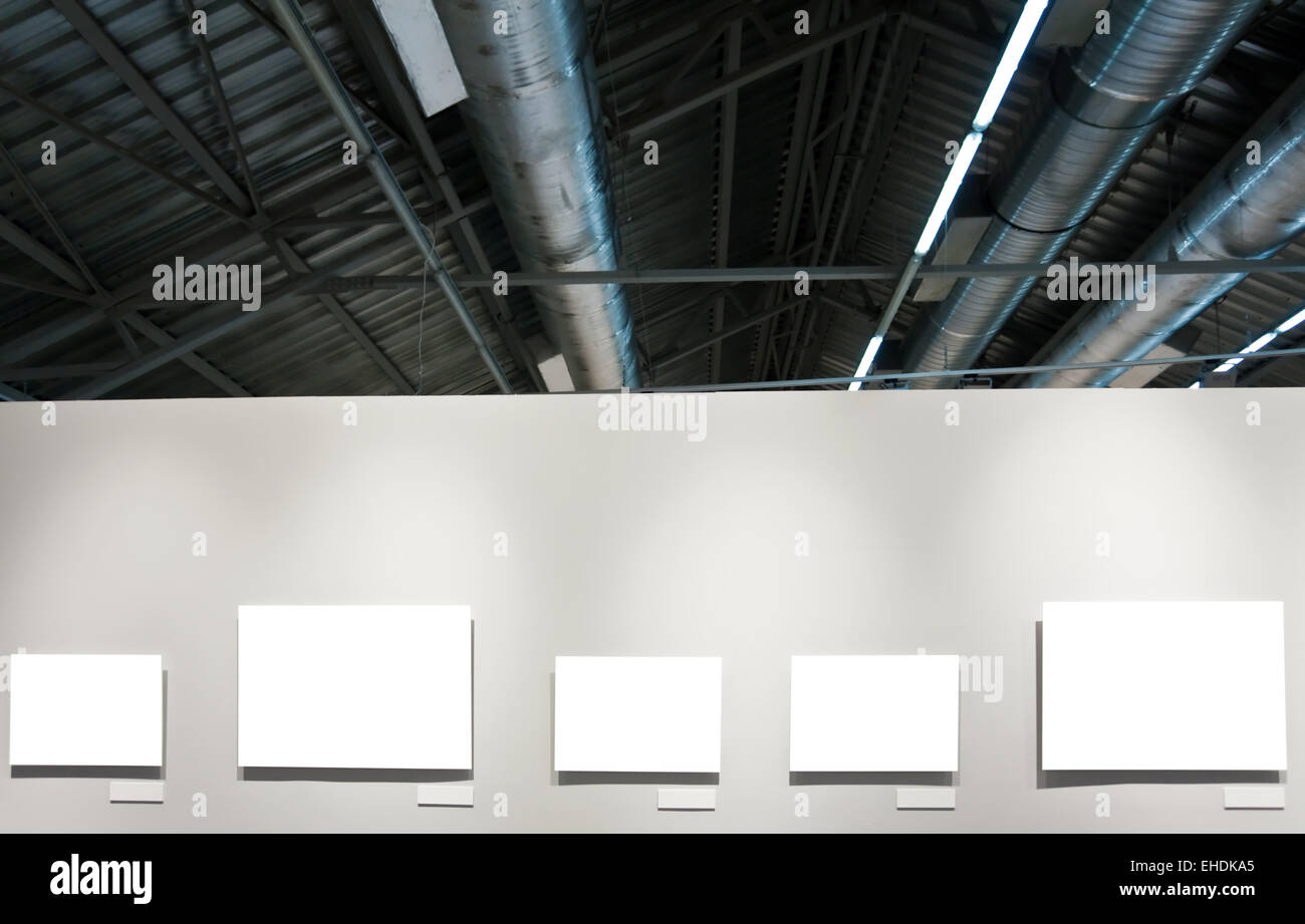 White wall in museum with empty frames Stock Photo - Alamy