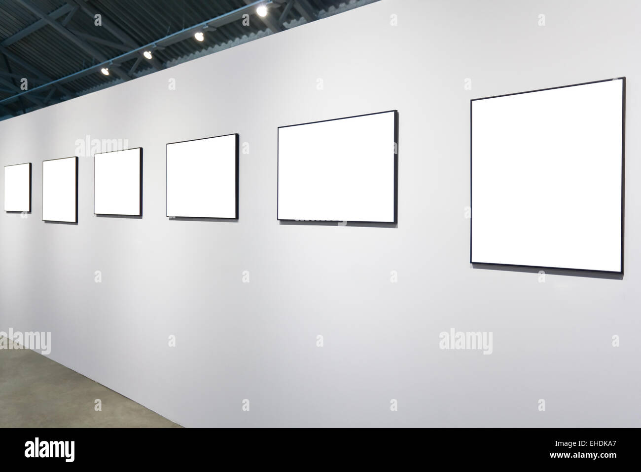 White wall in museum with empty frames Stock Photo - Alamy
