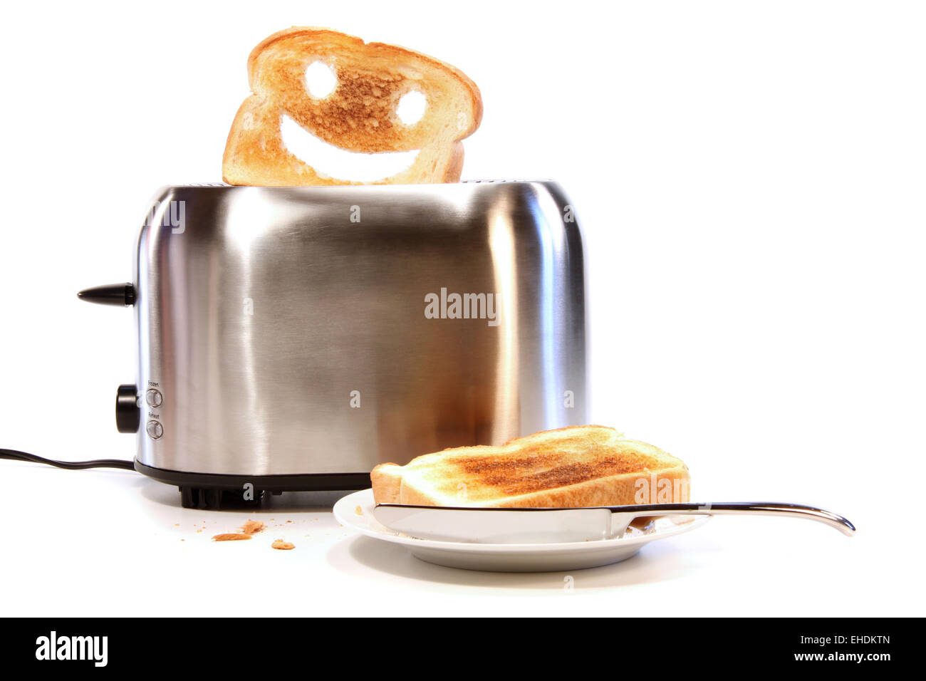 Toasted bread with toaster on white Stock Photo - Alamy