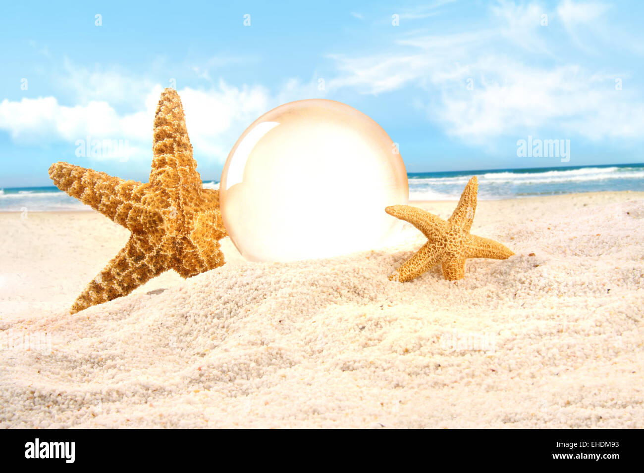 Crystal ball with starfish in the sand Stock Photo - Alamy