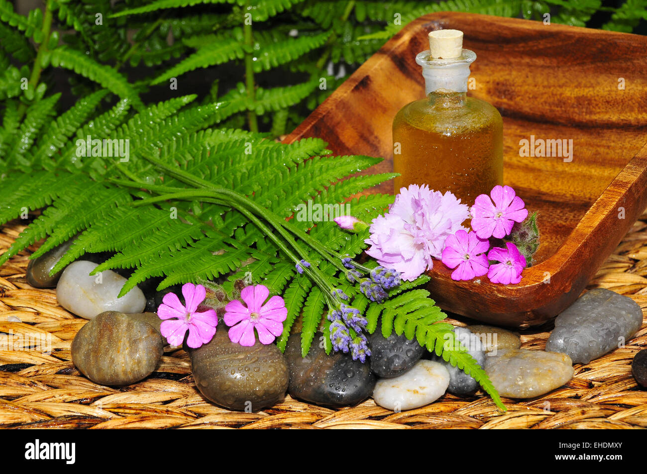 Wellness stones flowers Stock Photo - Alamy